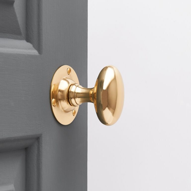 Raised Oval Door Knobs - Polished Brass