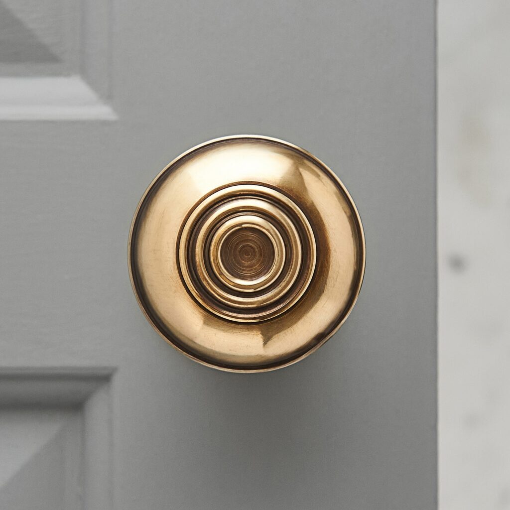 Large Bloxwich Regency Style Door Knobs in Aged Brass